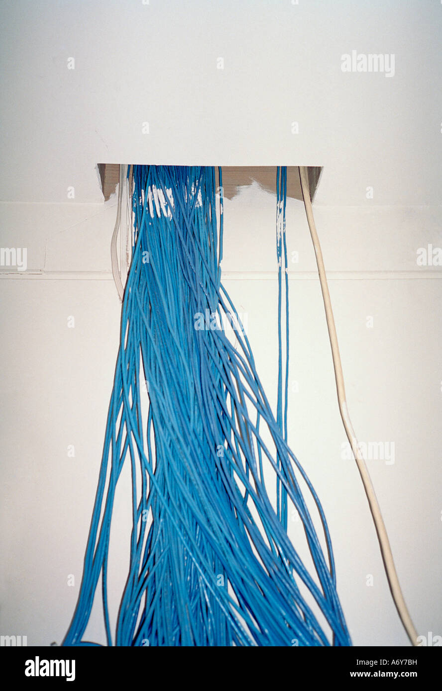Cables hanging from a duct in the ceiling Stock Photo - Alamy
