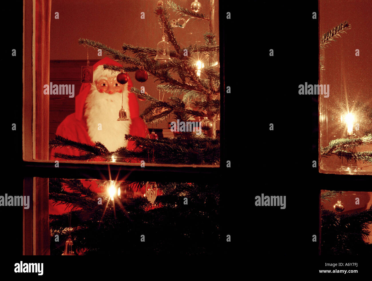 Santa claus looking through window hi-res stock photography and images ...