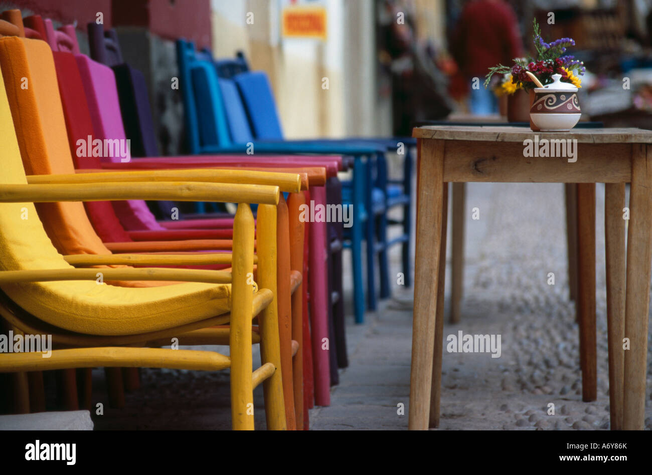 Colorful chairs and wooden tables at an outdoor cafe Peru Stock Photo ...