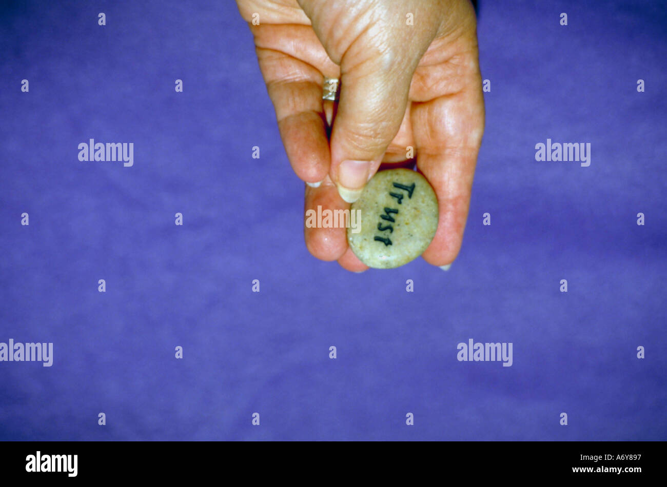 Hand Rock Printed Word Trust Stock Photo - Alamy