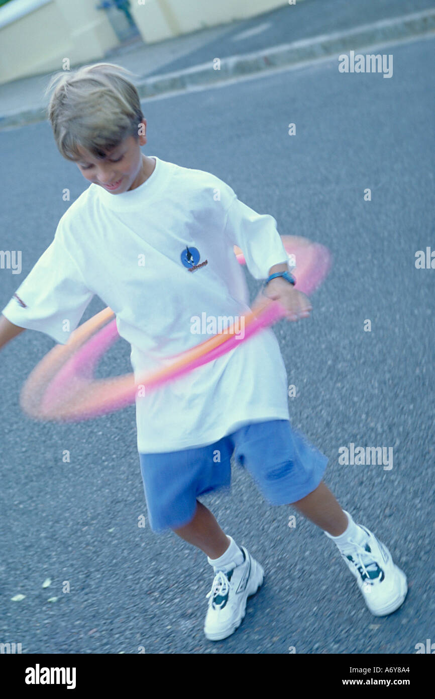 portrait of a boy playing with a hola-hoop Stock Photo - Alamy