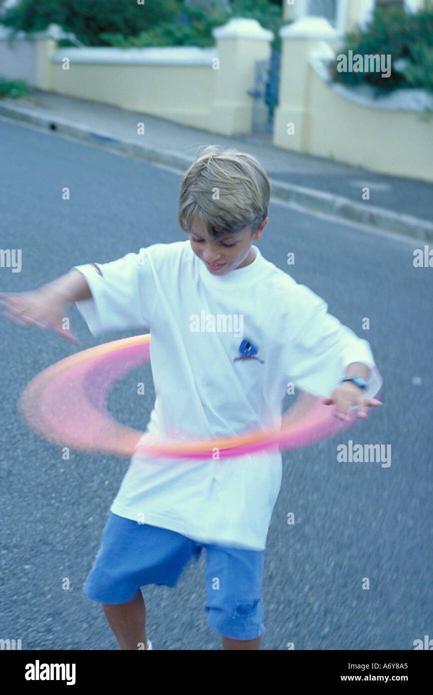 portrait of a boy playing with a hola-hoop Stock Photo - Alamy