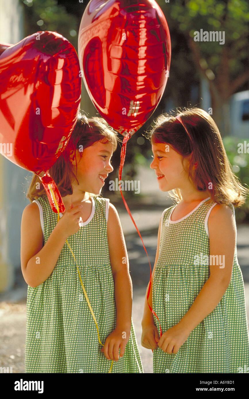 Happy twin sisters playing hi-res stock photography and images - Alamy