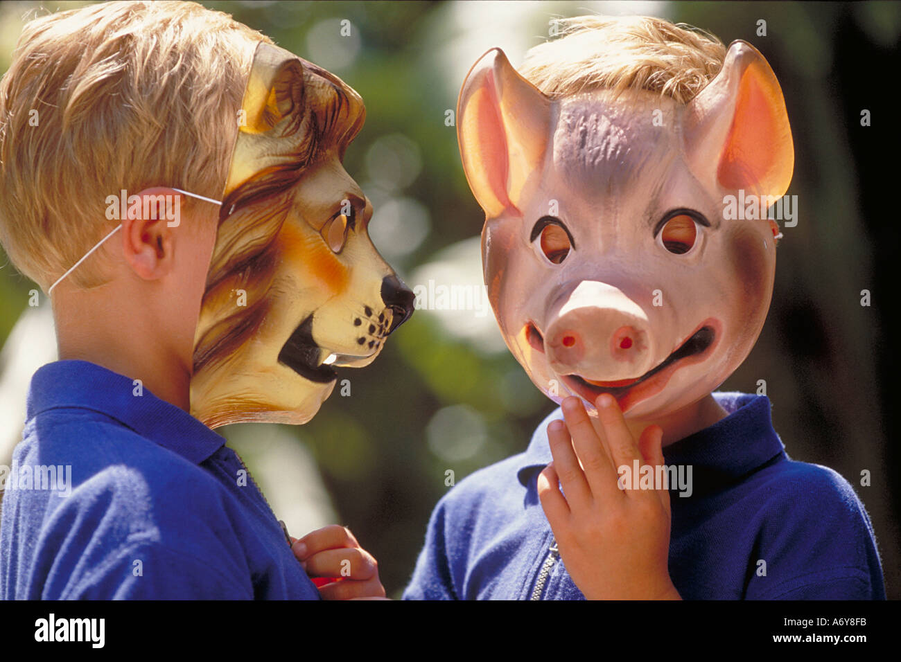 portrait of two boys wearing masks Stock Photo - Alamy