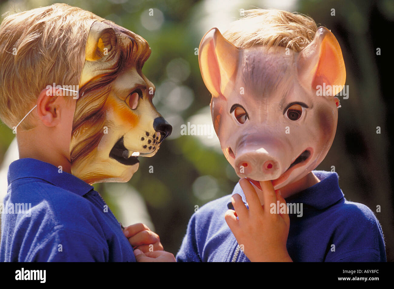 portrait of two boys wearing masks Stock Photo - Alamy