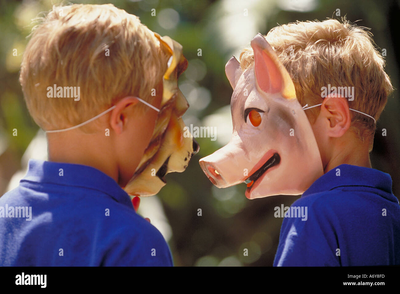 portrait of two boys wearing masks Stock Photo - Alamy
