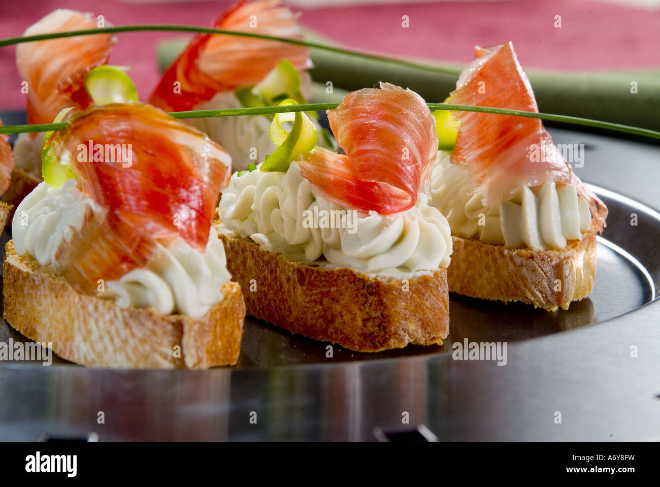 Tray of ciabatta toasts with Philadelphia blue cheese and Iberian ham ...