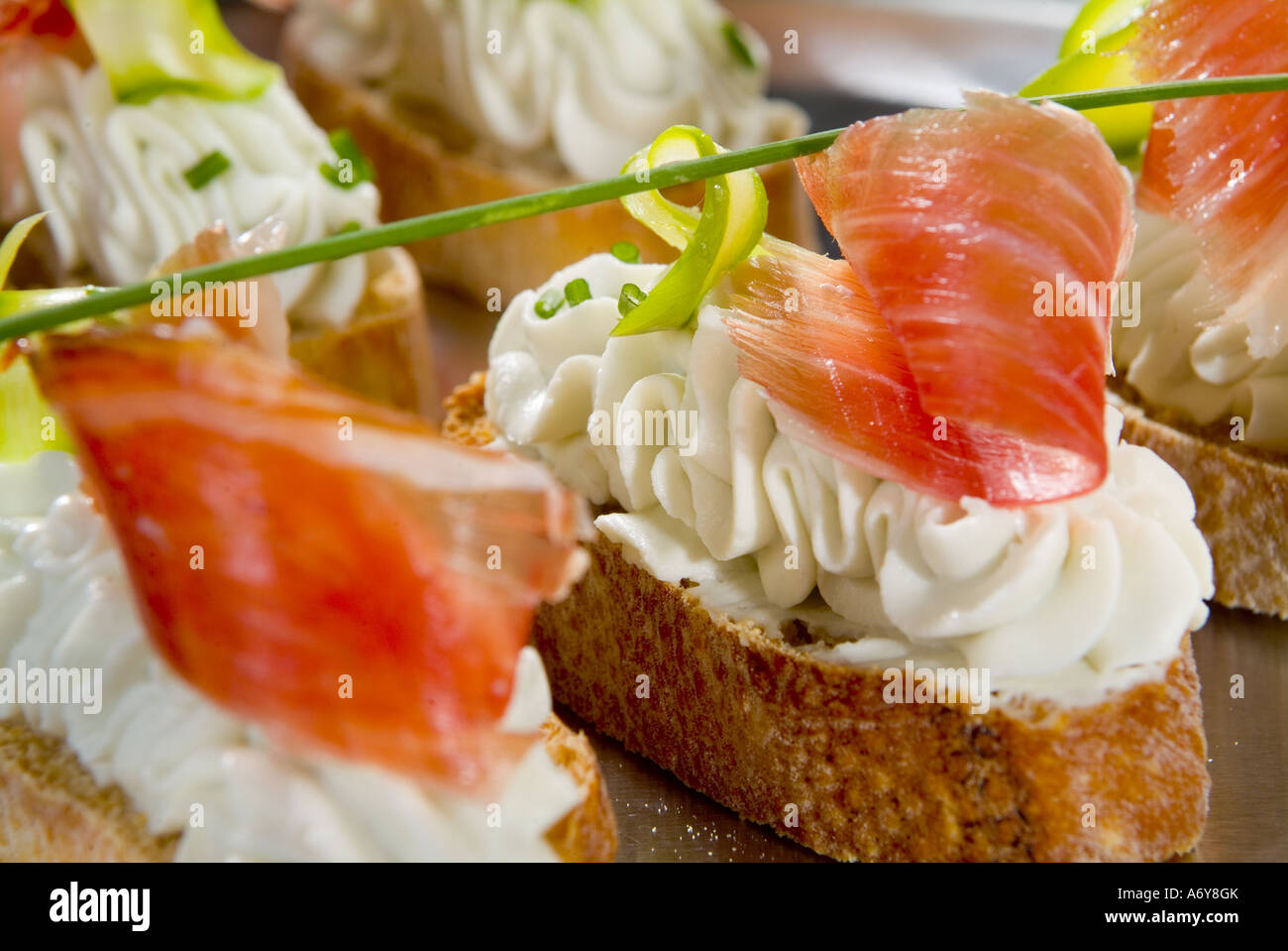Tray of ciabatta toasts with Philadelphia blue cheese and Iberian ham ...