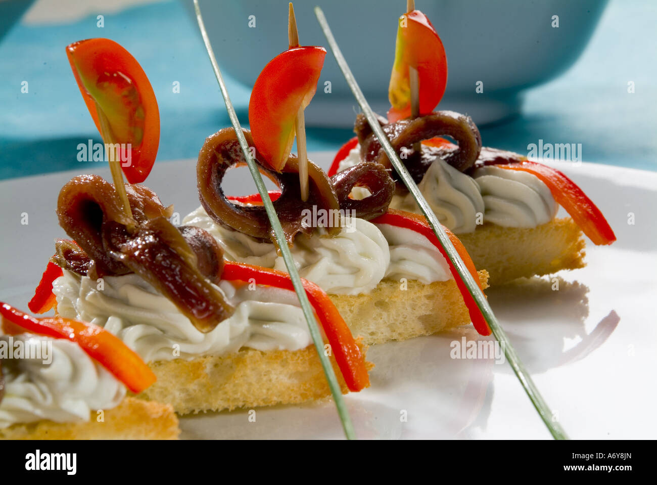 Tray of Philadelphia blue cheese triangles with anchovy and red pepper ...