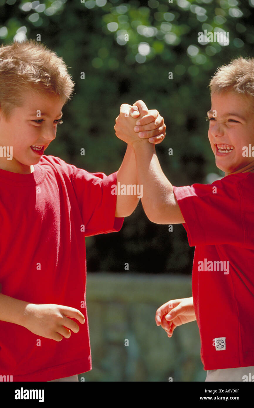 portrait of twin brothers fighting Stock Photo - Alamy