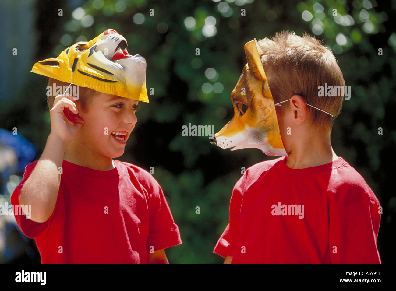 portrait of two boys wearing masks Stock Photo - Alamy