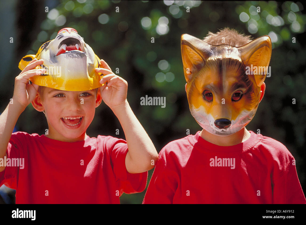 portrait of two boys wearing masks Stock Photo - Alamy