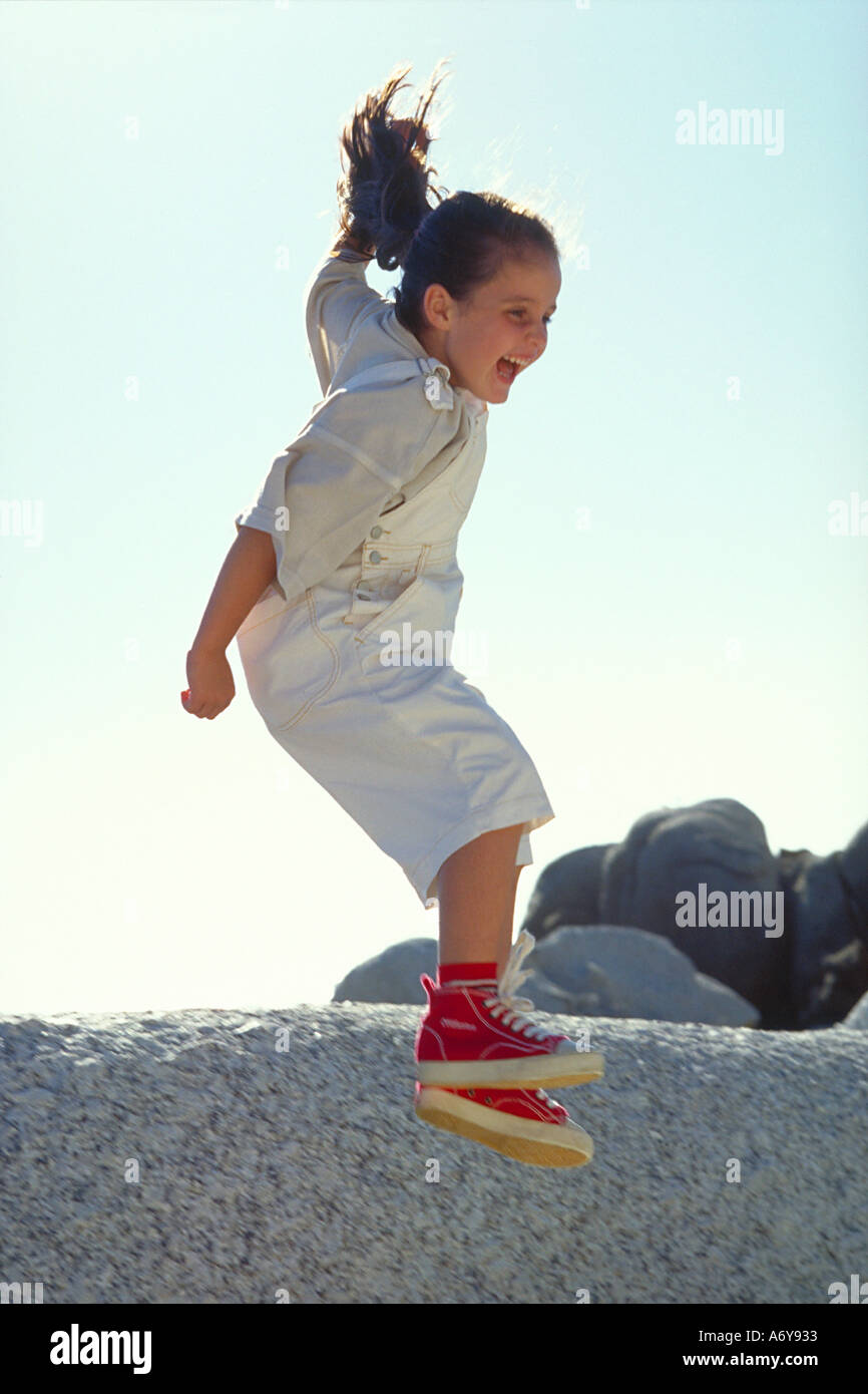 Child jumping off wall hi-res stock photography and images - Alamy
