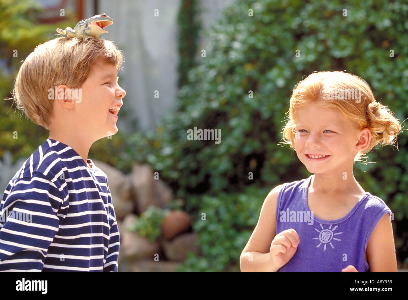 portrait of a boy and a girl fooling around Stock Photo - Alamy
