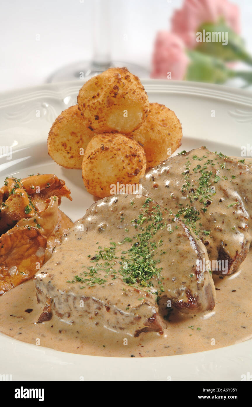 Venison steak cooked in juniper sauce Stock Photo - Alamy