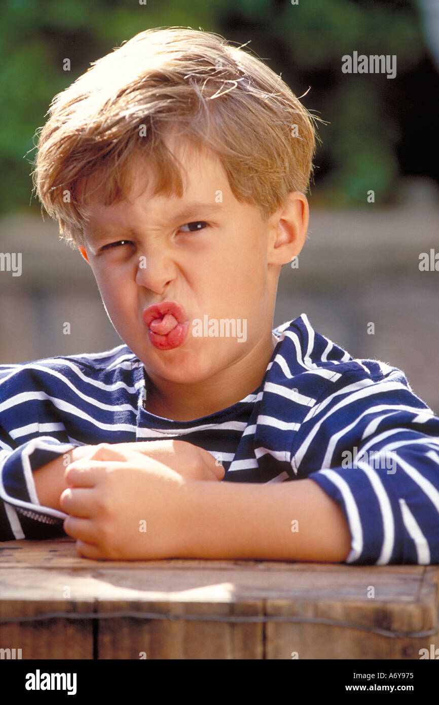 portrait of a boy pulling a face Stock Photo - Alamy