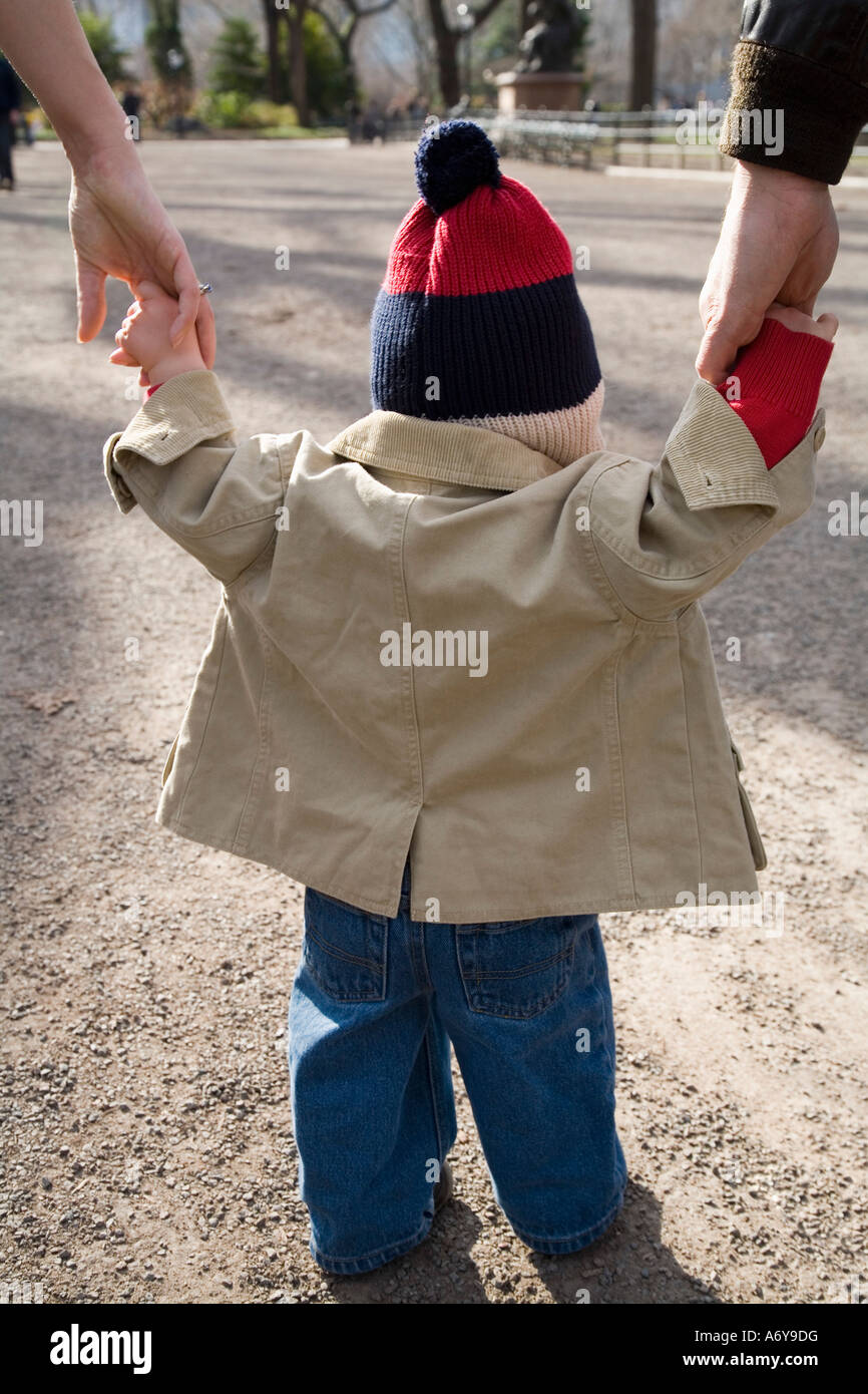 Young boy learning to walk Stock Photo - Alamy