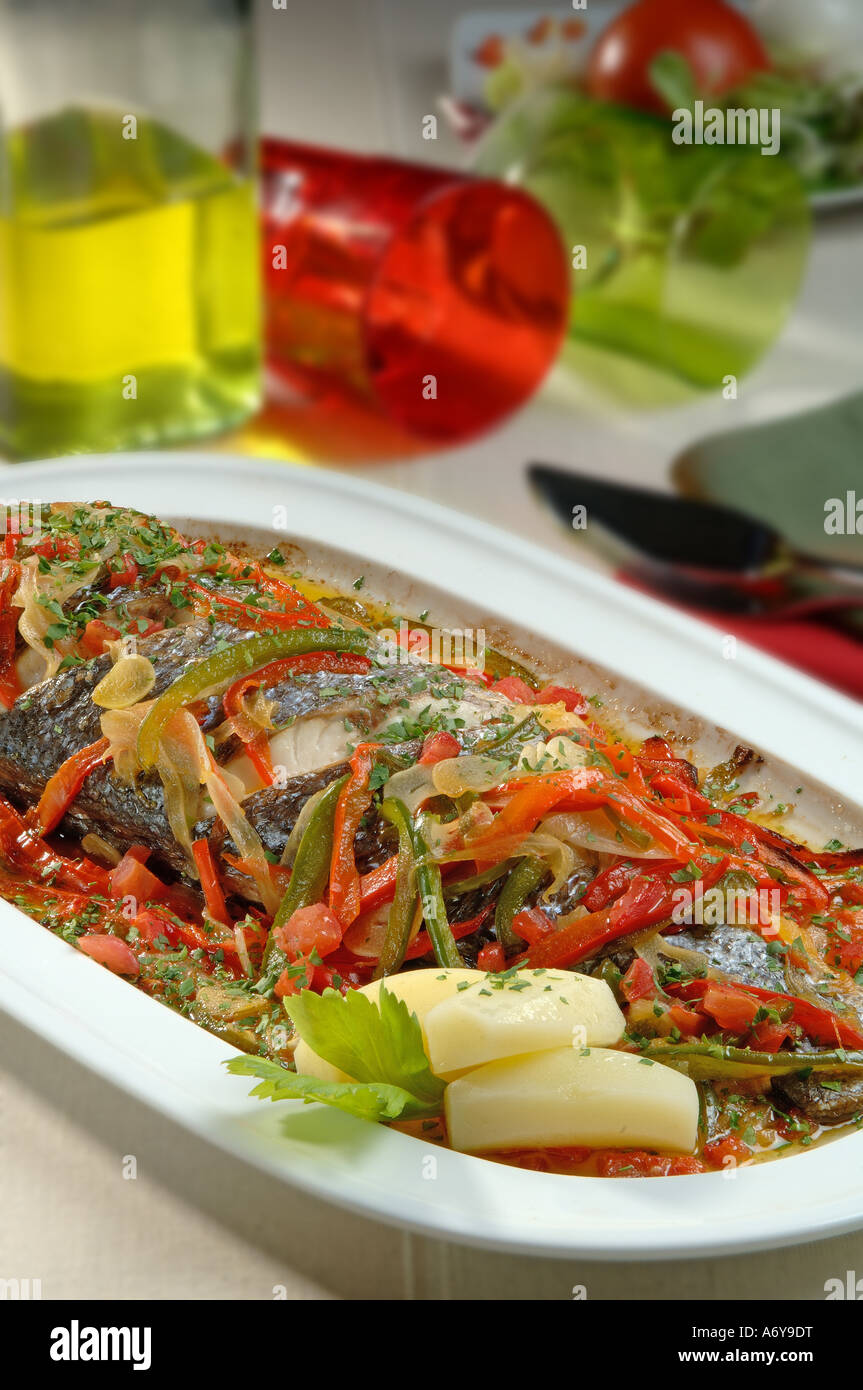 Roast red bass with vegetables Stock Photo - Alamy