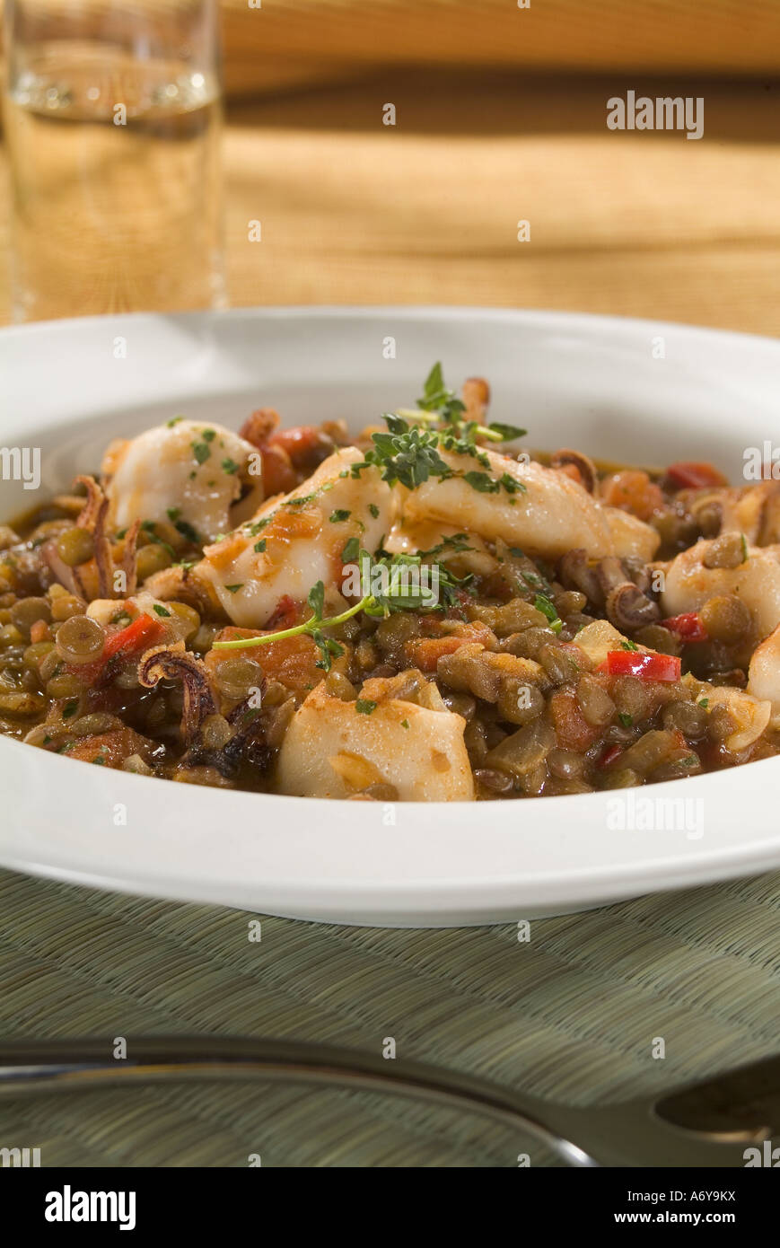 Baby squid with lentils Stock Photo - Alamy