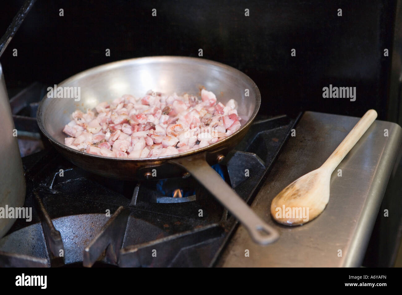 White meat cooking in a fry pan Stock Photo - Alamy