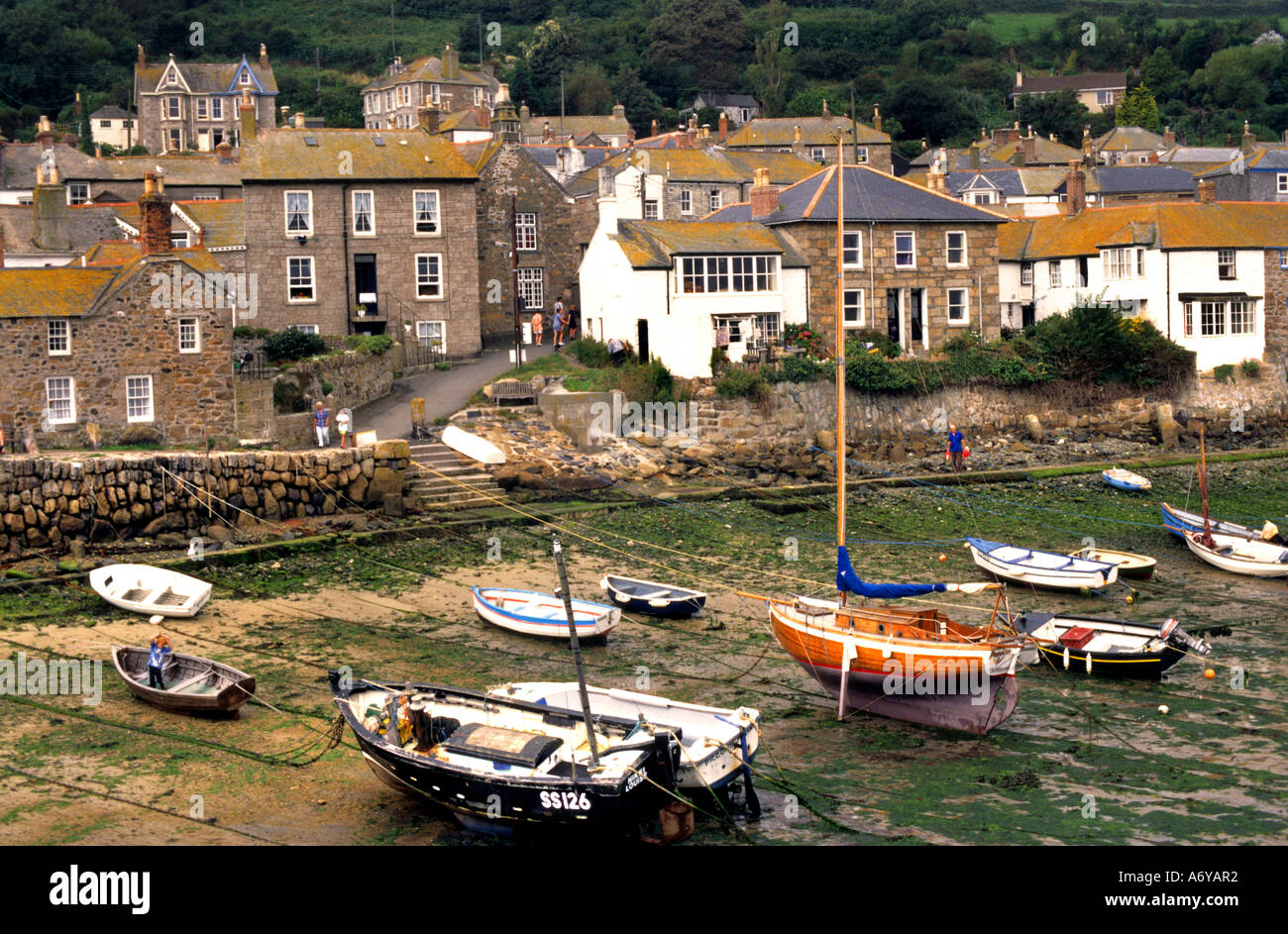 Mousehole Cornwall's most picturesque hamlets The harbour at low tide ...