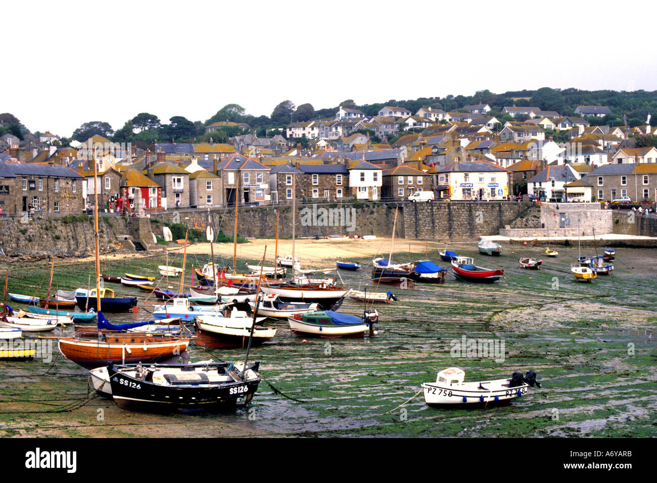 Mousehole Cornwall's most picturesque hamlets The harbour at low tide ...