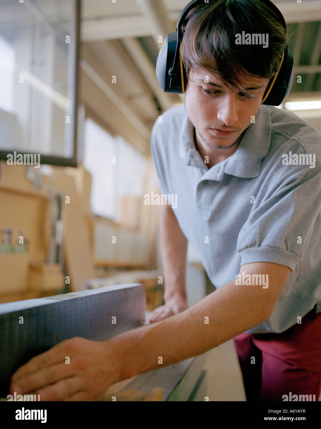 Carpenter working in a workshop Stock Photo - Alamy
