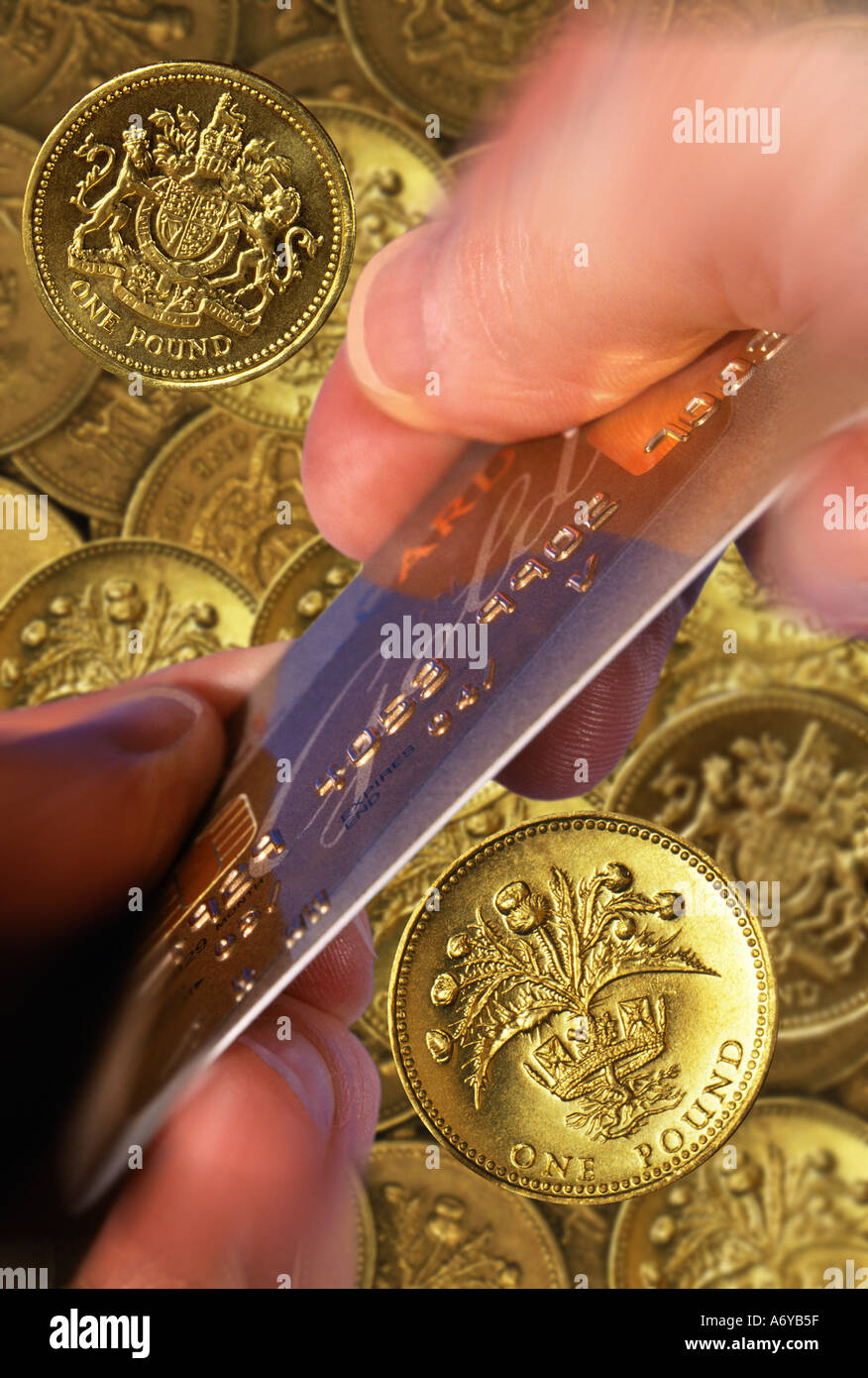 Hands exchanging credit card and UK Pound coins Stock Photo - Alamy