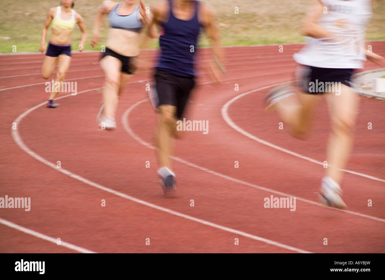 Group of athletes running on a track Stock Photo - Alamy
