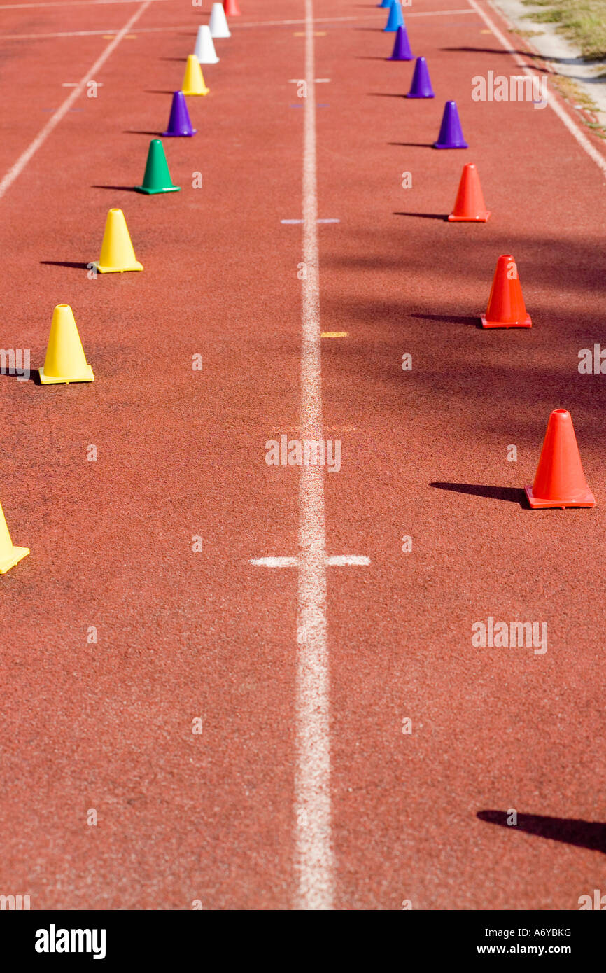 Colored markers on a running track Stock Photo - Alamy