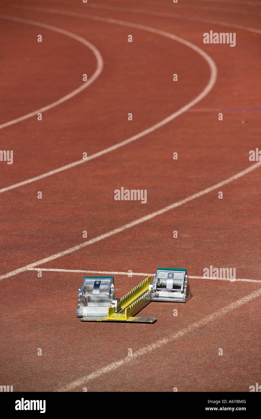 Starting blocks on a running track Stock Photo - Alamy