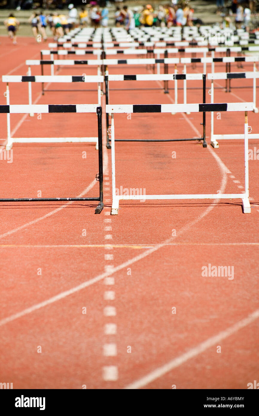 Hurdles arranged on a running track Stock Photo - Alamy