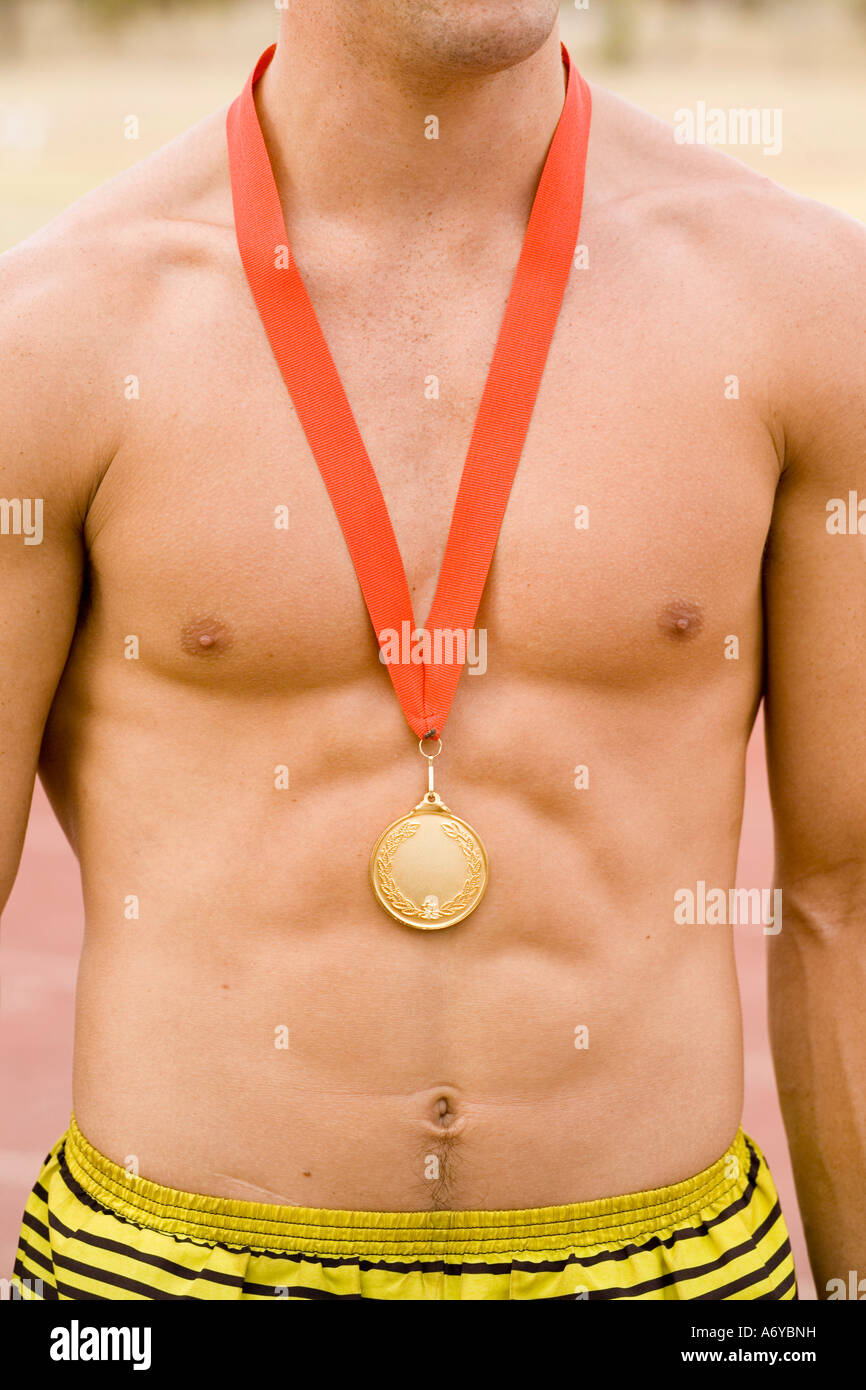 Young man wearing a gold medal Stock Photo - Alamy