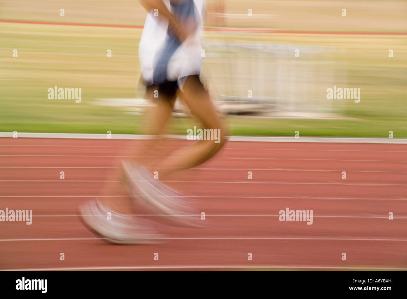 Male athlete running on a track Stock Photo - Alamy