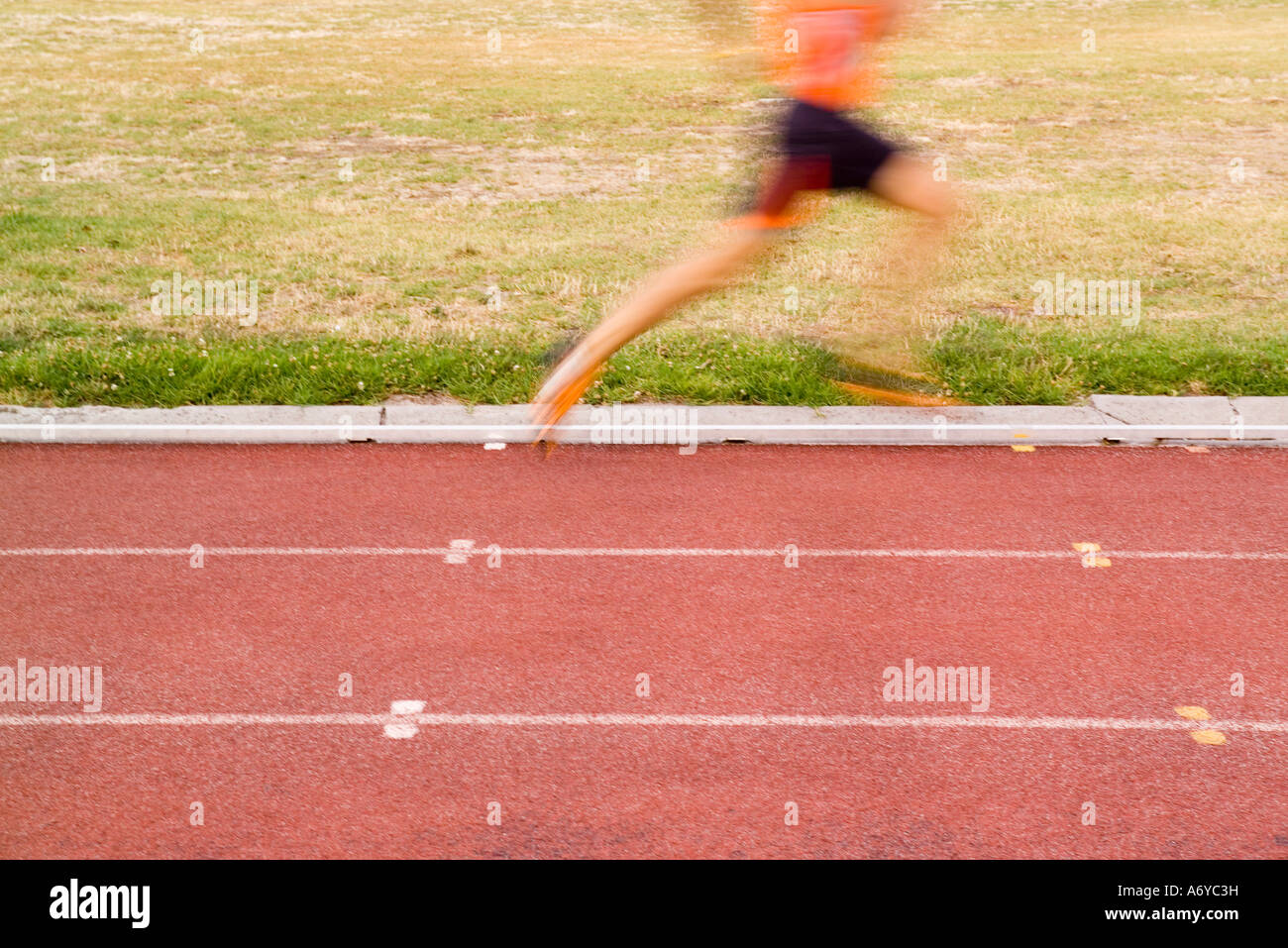 Male athlete running on a track Stock Photo - Alamy