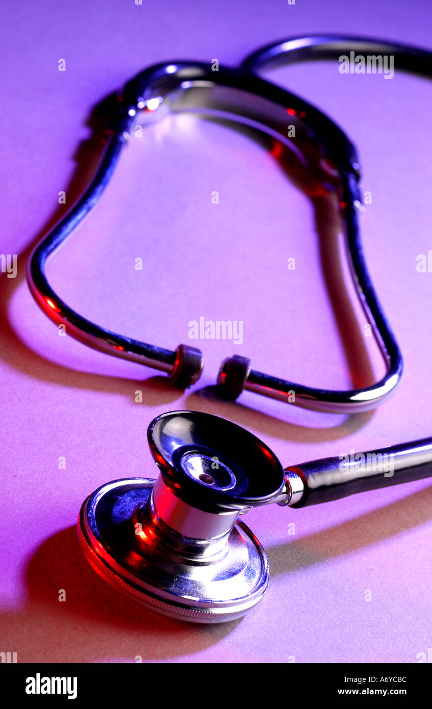Vertical colored concept image of a stethoscope on a mult colored ...