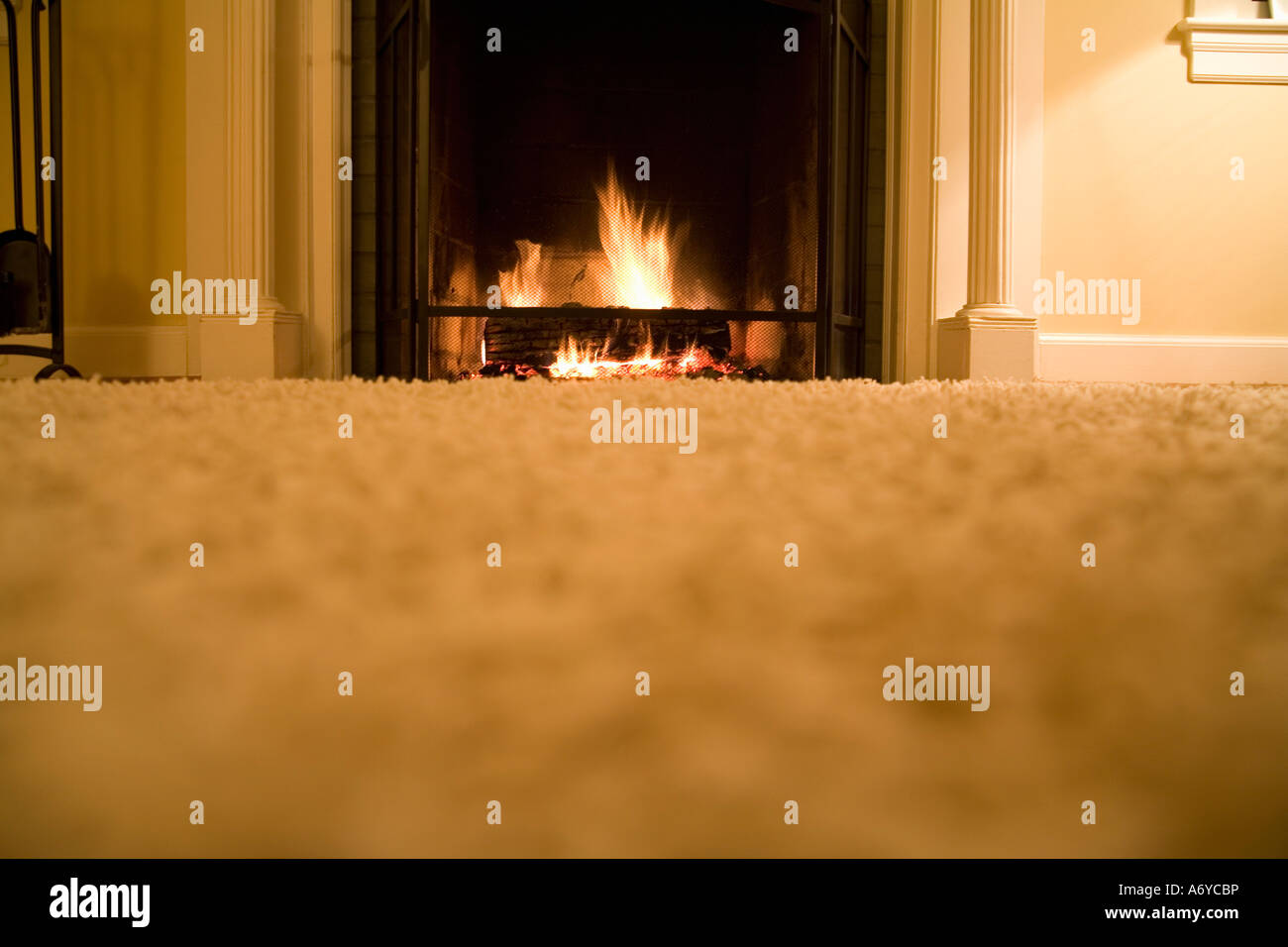 Domestic room with log fire Stock Photo - Alamy
