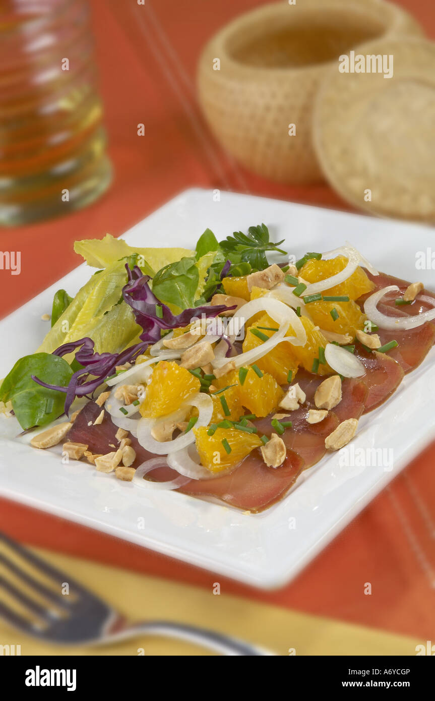 Dried salted tuna with orange spring onion and almonds Stock Photo - Alamy