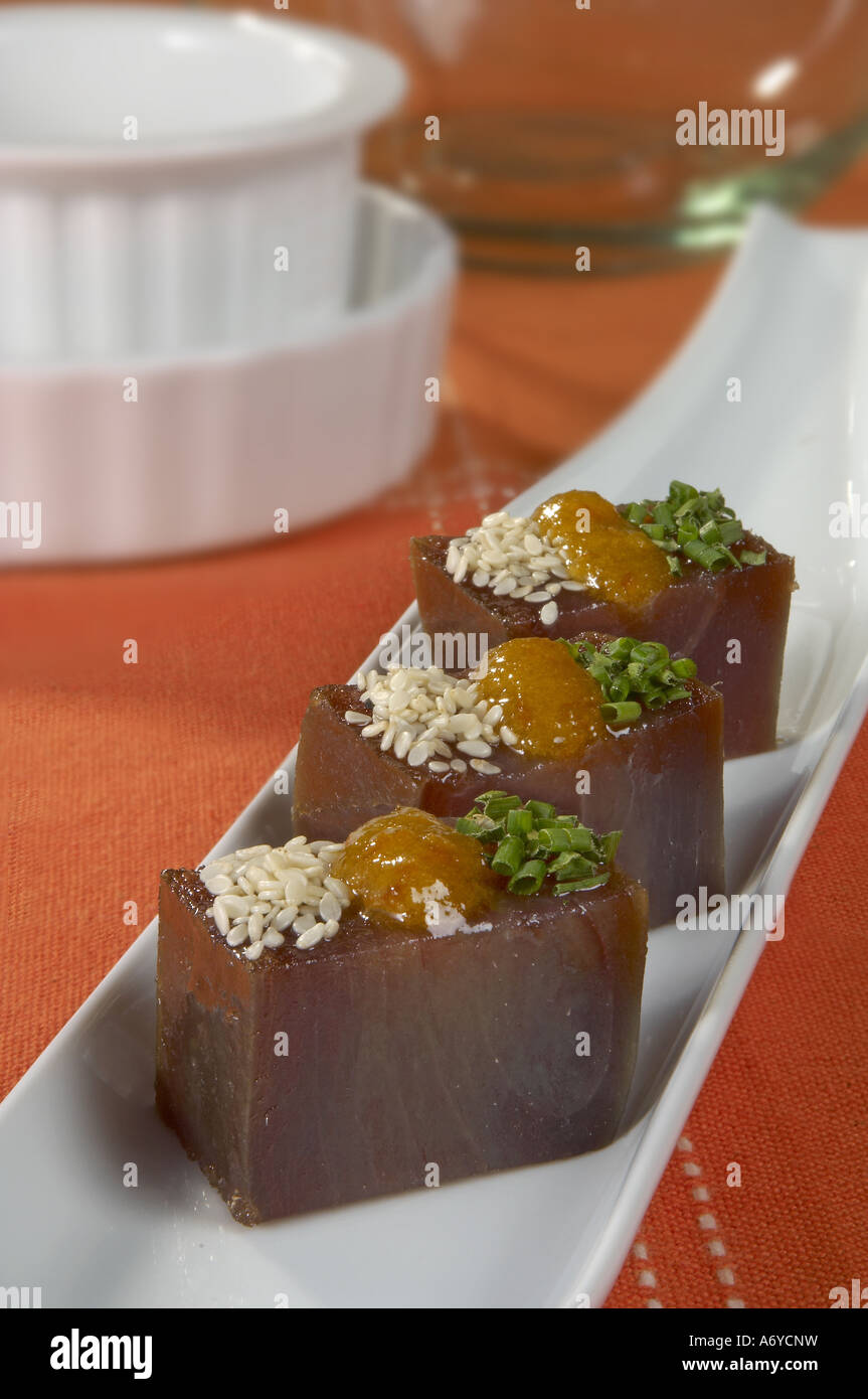 Dried salted tuna chunk with orange jam sesame and chives Stock Photo ...