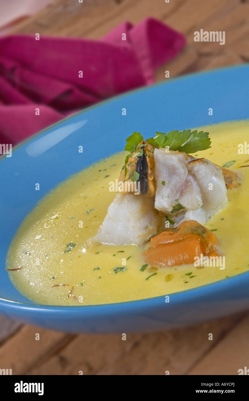 Mussel and monkfish soup with saffron Stock Photo - Alamy