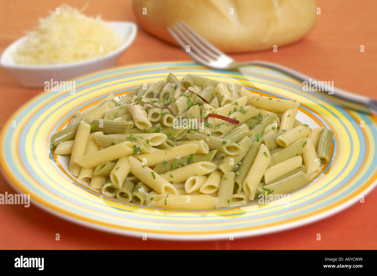 Colour macaroni with oil and garlic sauce Stock Photo - Alamy