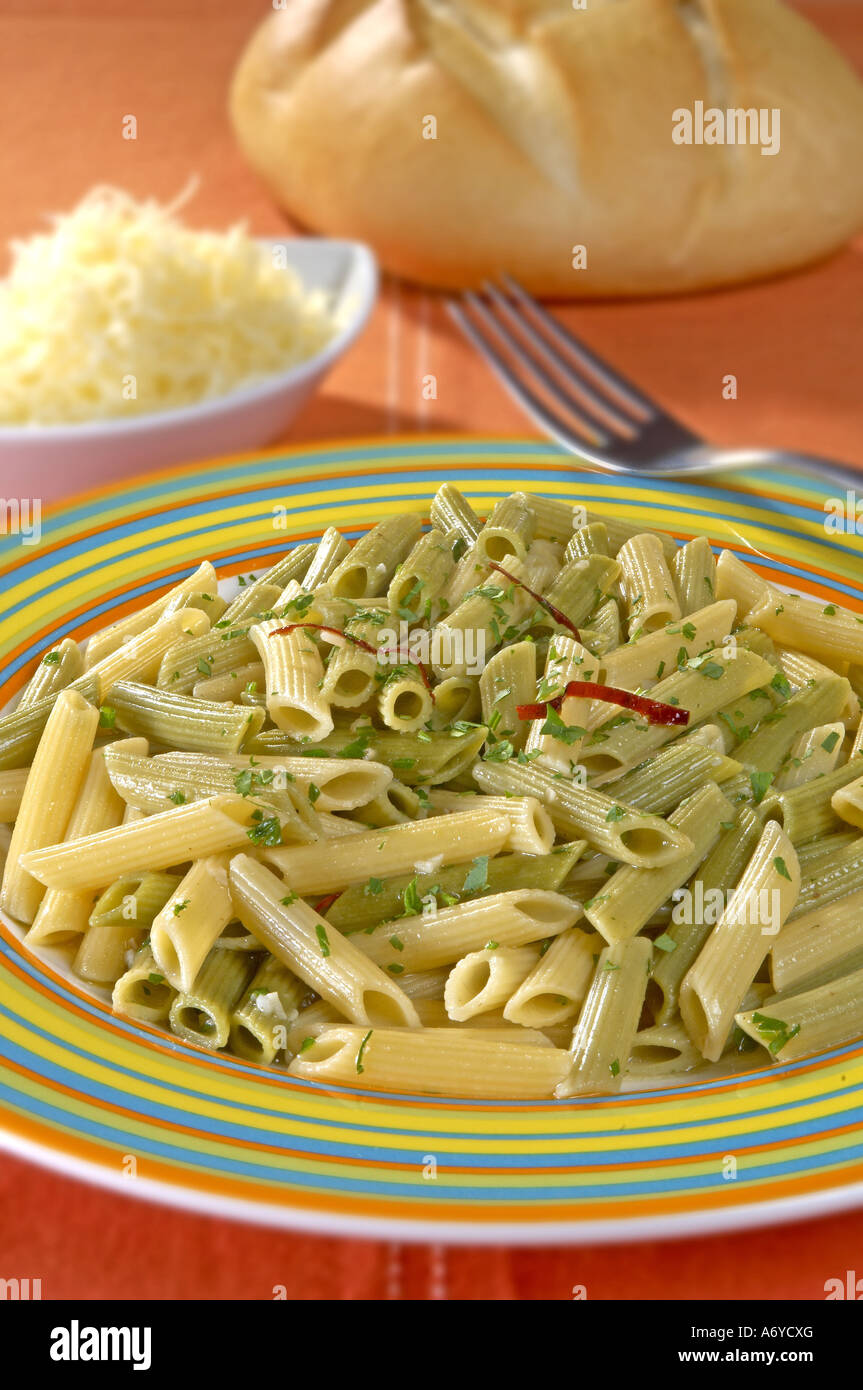 Colour macaroni with oil and garlic sauce Stock Photo - Alamy