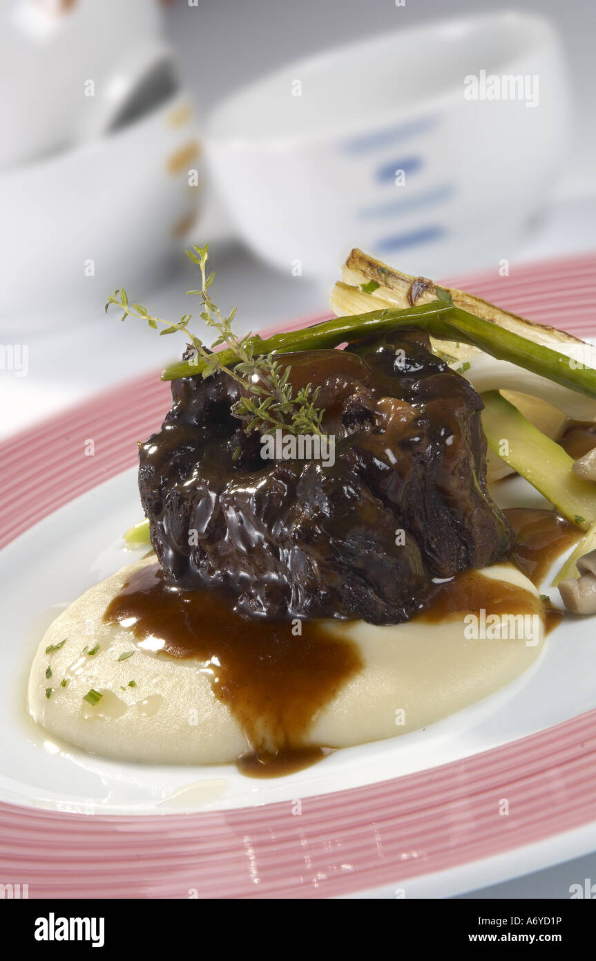 Cow s tail stewed with red wine with vegetables Stock Photo - Alamy