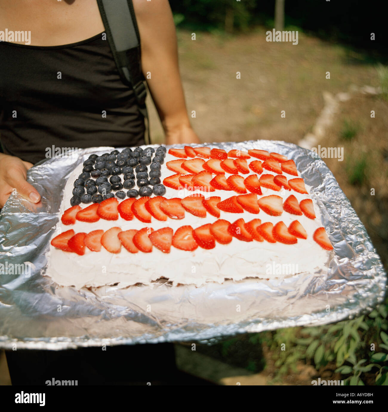 Woman carrying a cake Stock Photo - Alamy