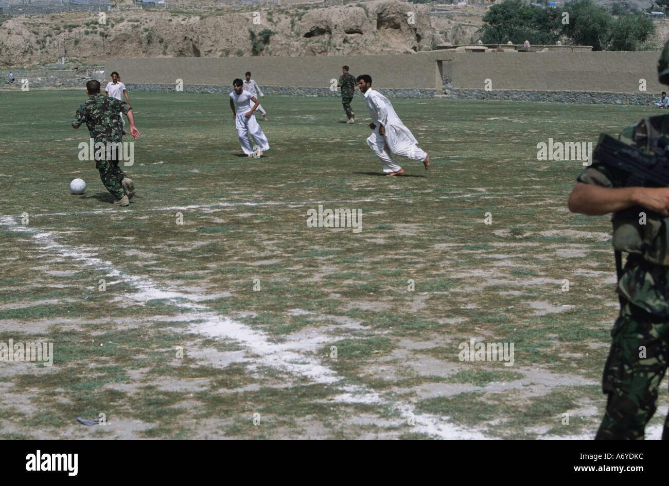 British soldiers playing football during a patrol in Kabul, Afghanistan ...