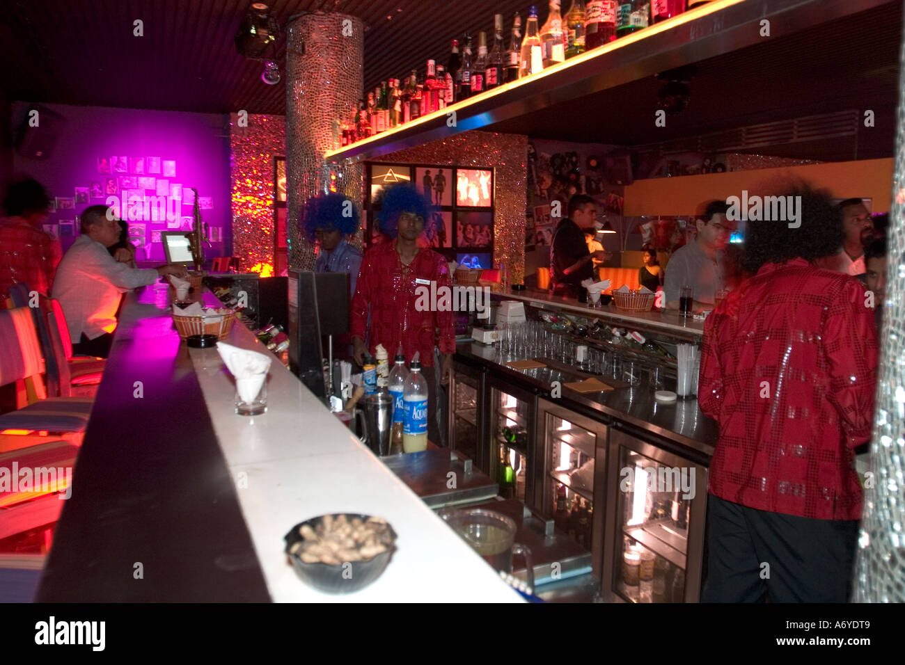 Young Indians enjoying a night out at the bar in a nightclub, Bombay ...