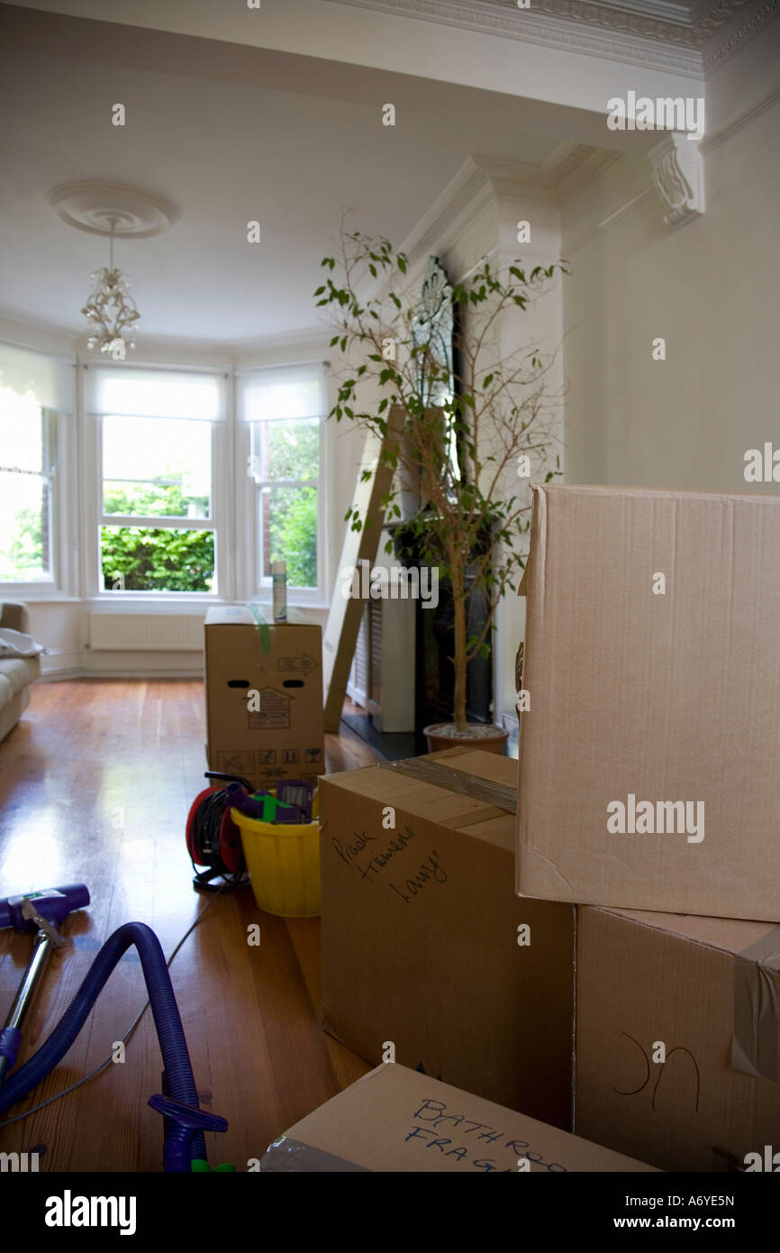 Cardboard boxes and furniture packed up for moving house Stock Photo ...
