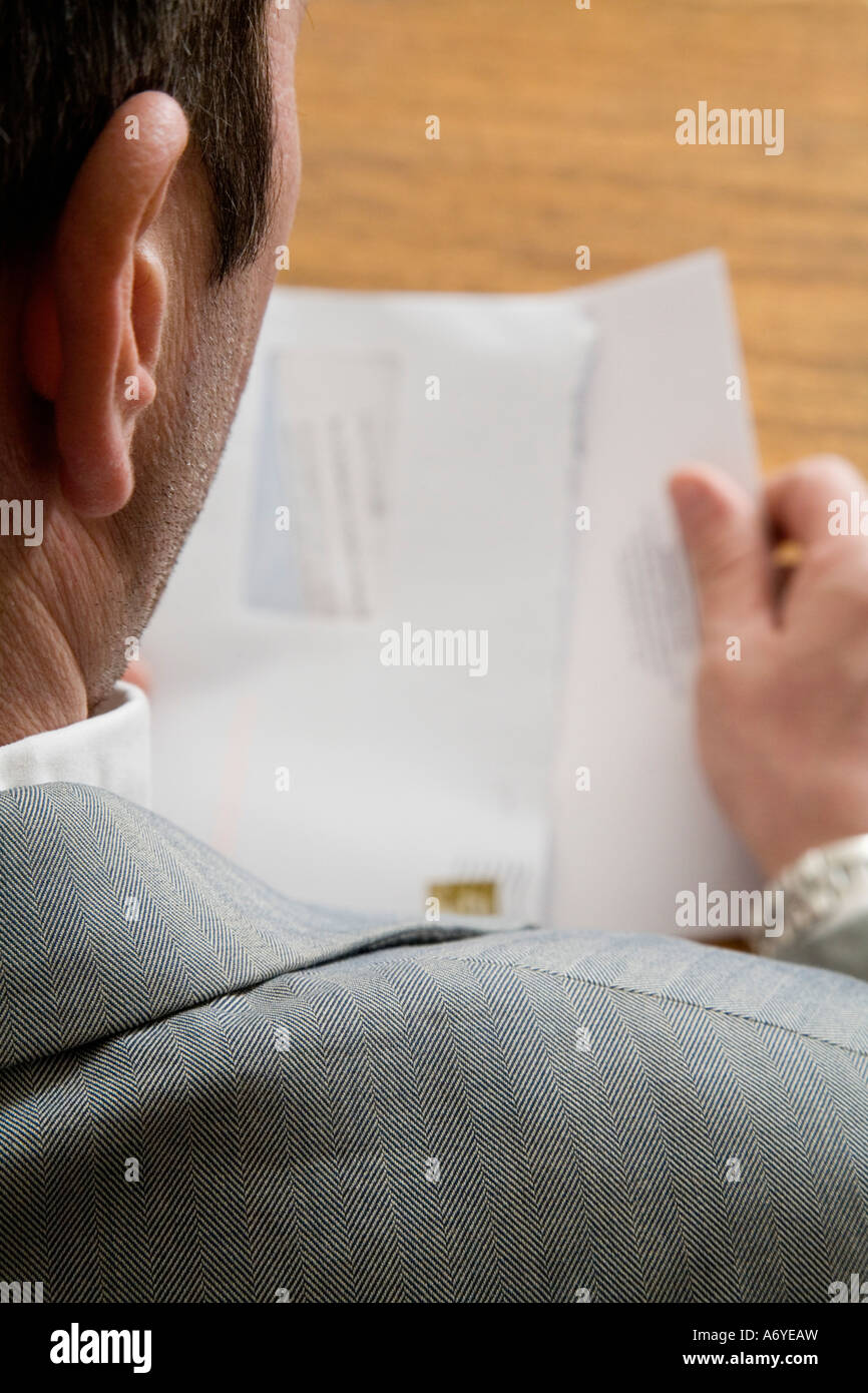 Businessman opening an envelope Stock Photo - Alamy