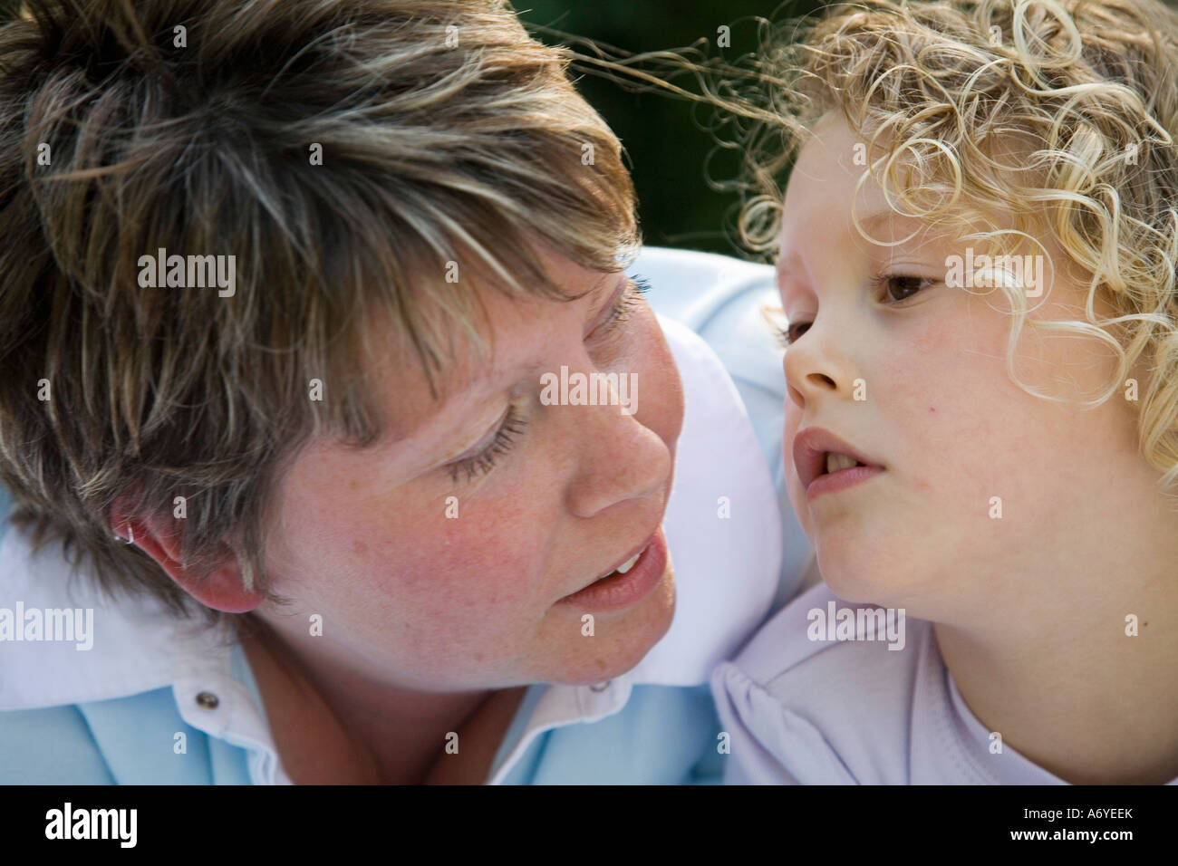 Mother and daughter face to face Stock Photo - Alamy