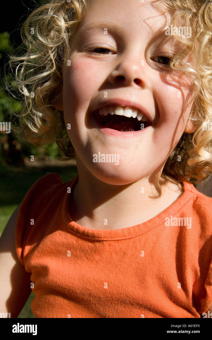 Young girl with a mouthful of jello Stock Photo - Alamy